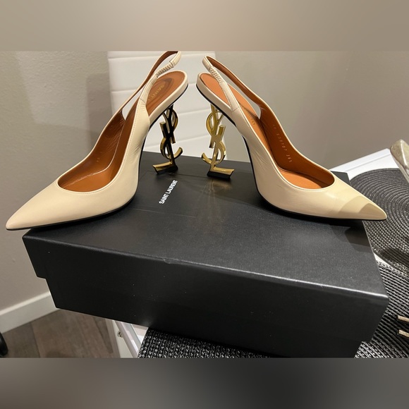 Yves Saint Laurent | Shoes | Ysl A Sculpted Logo Heel Anchors These ...